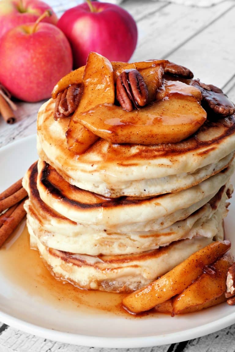Autumn pancake stack with baked apples, pecans and cinnamon topped with ...